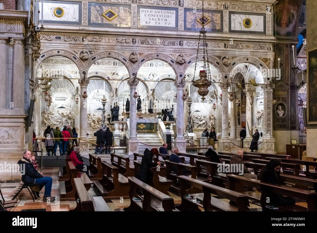 The shrine Tomba di San Antonio and prayer benches inside the church ...