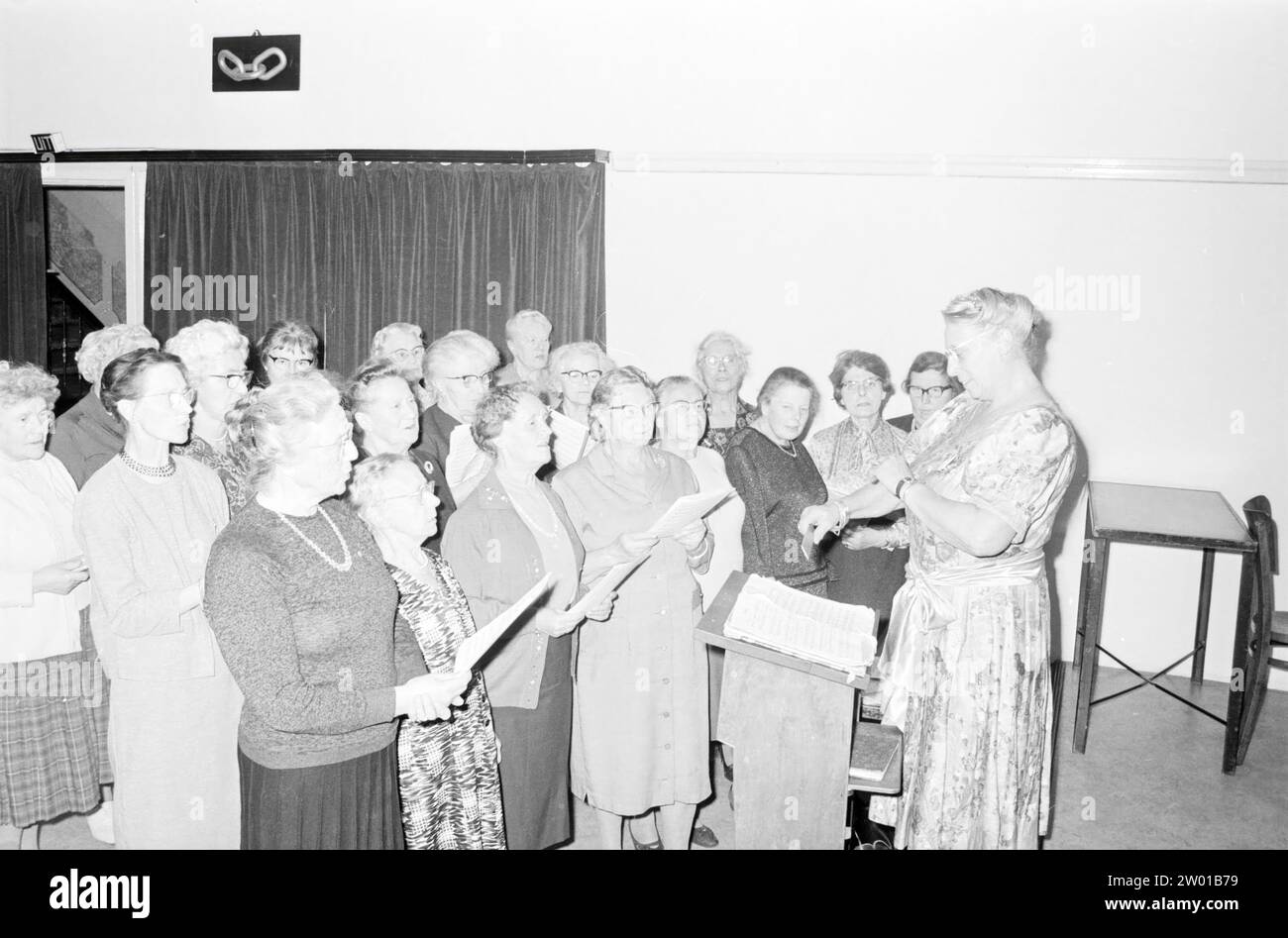 Women's choir with female conductor during rehearsal., Whizgle News ...