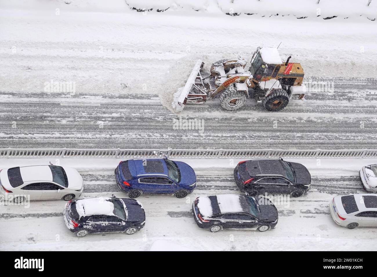 YANTAI, CHINA - DECEMBER 21, 2023 - Large machinery clears snow on a ...