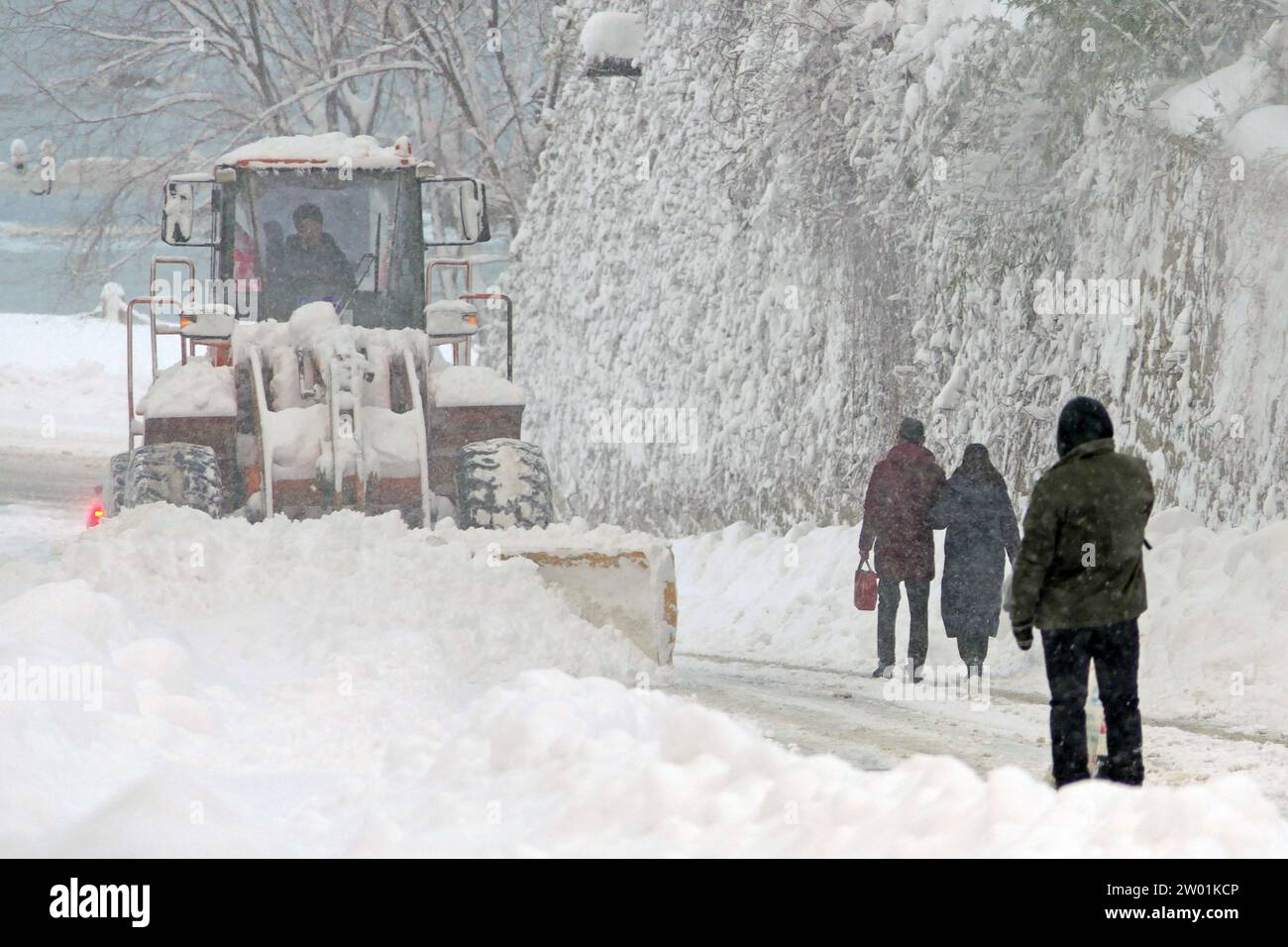 YANTAI, CHINA - DECEMBER 21, 2023 - Large machinery clears snow on a ...
