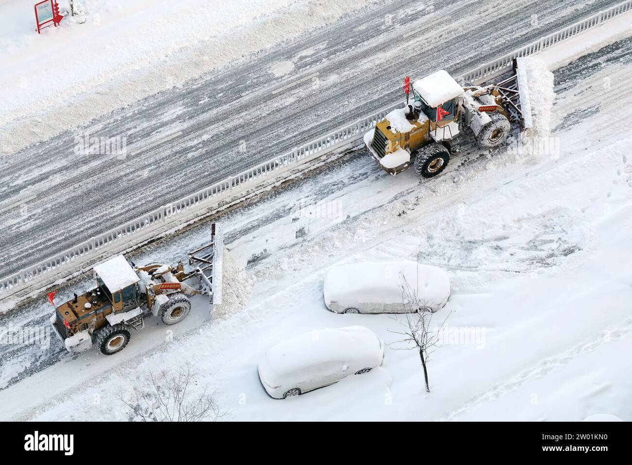 YANTAI, CHINA - DECEMBER 21, 2023 - Large machinery clears snow on a ...
