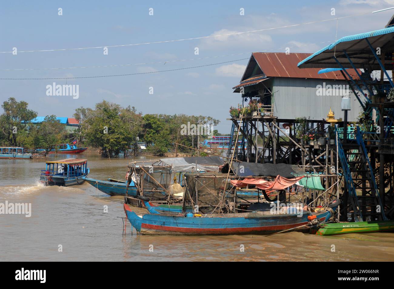 Boats moving along the waterways, Floating village Kampong Phluk in ...