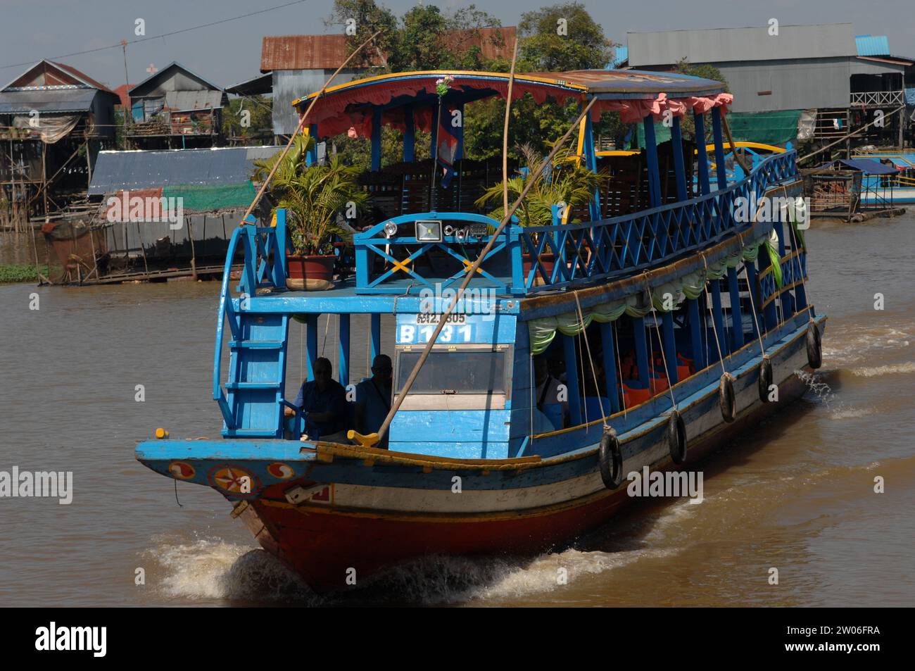 Boats moving along the waterways, Floating village Kampong Phluk in ...