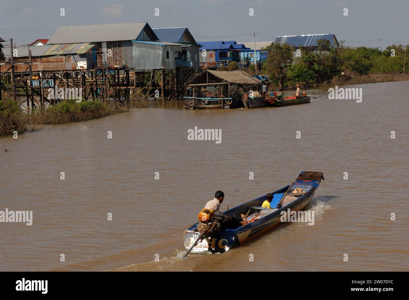 Boats moving along the waterways, Floating village Kampong Phluk in ...