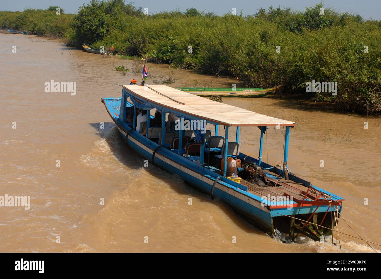 Boats moving along the waterways, Floating village Kampong Phluk in ...