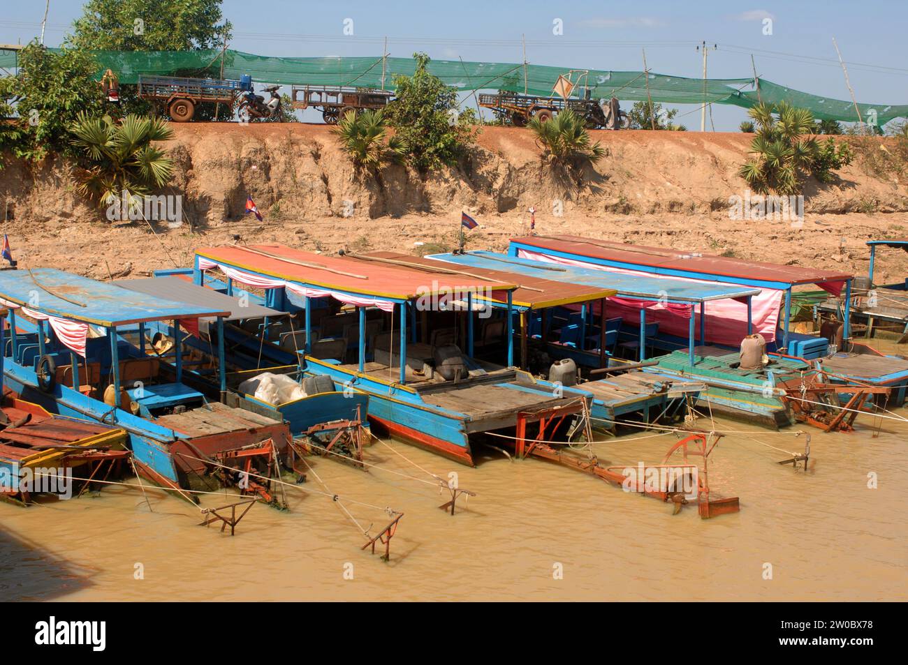 Boats moored, Lady selling food on a floating shop, Floating village ...