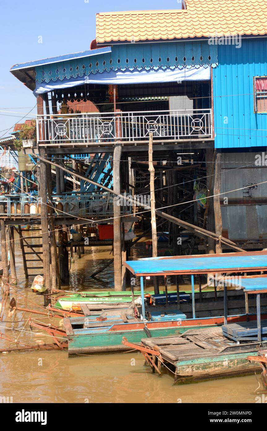 Boats moored, Lady selling food on a floating shop, Floating village ...