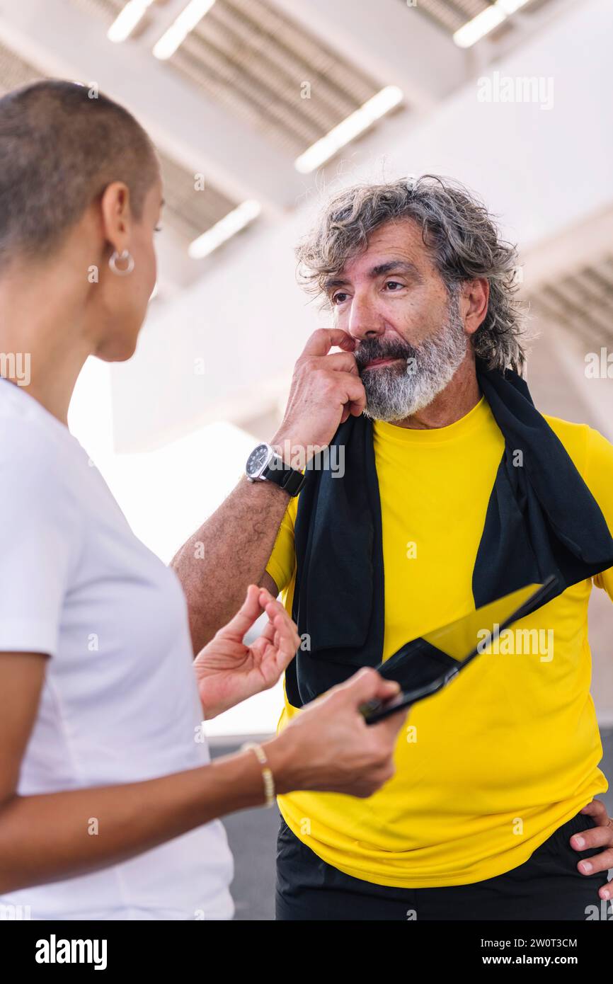 man and trainer watching progress of training Stock Photo - Alamy