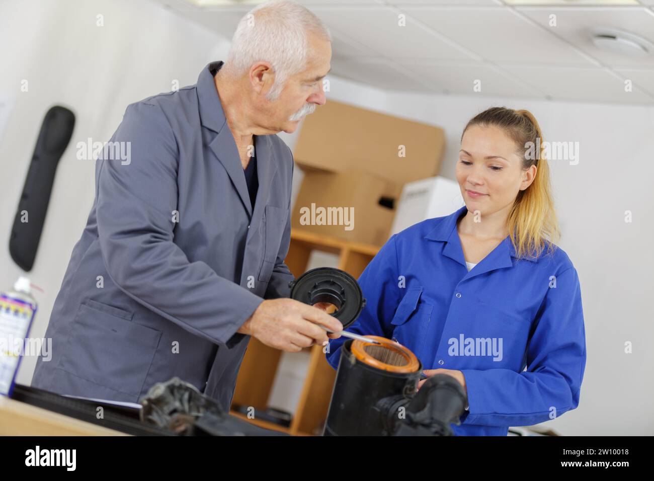 female future mechanic learning the parts Stock Photo - Alamy