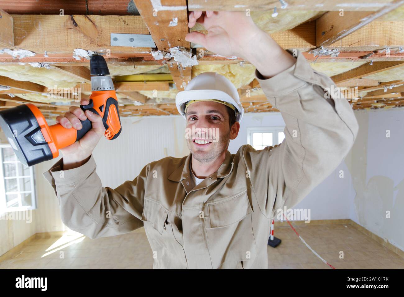construction worker wear safety uniform installation ceiling work Stock ...