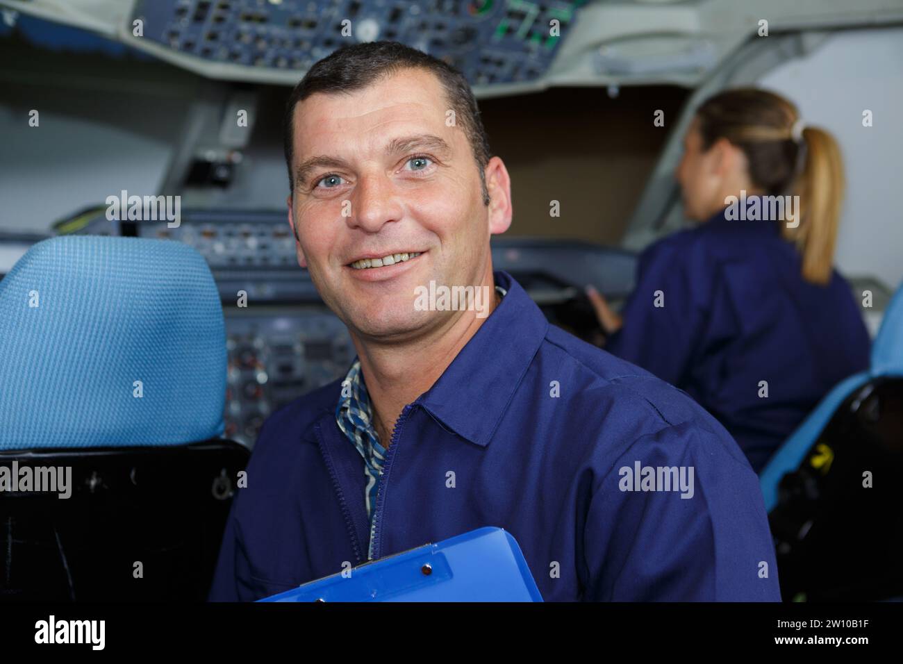 portrait of male engineer in aircraft cockpit Stock Photo - Alamy