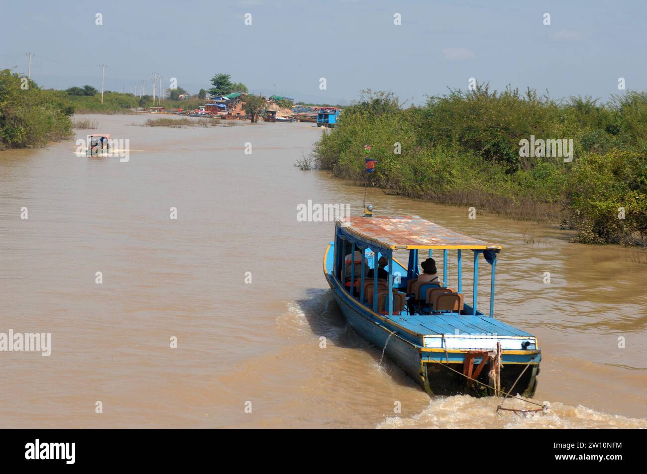 Boats moving along the waterways, Floating village Kampong Phluk in ...