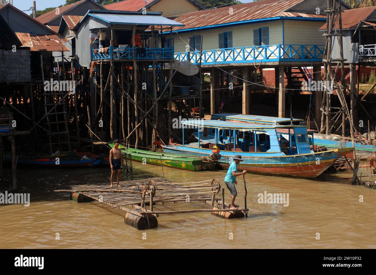 Boats moored, Lady selling food on a floating shop, Floating village ...