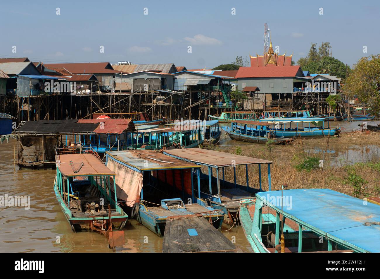 Boats moored, Lady selling food on a floating shop, Floating village ...
