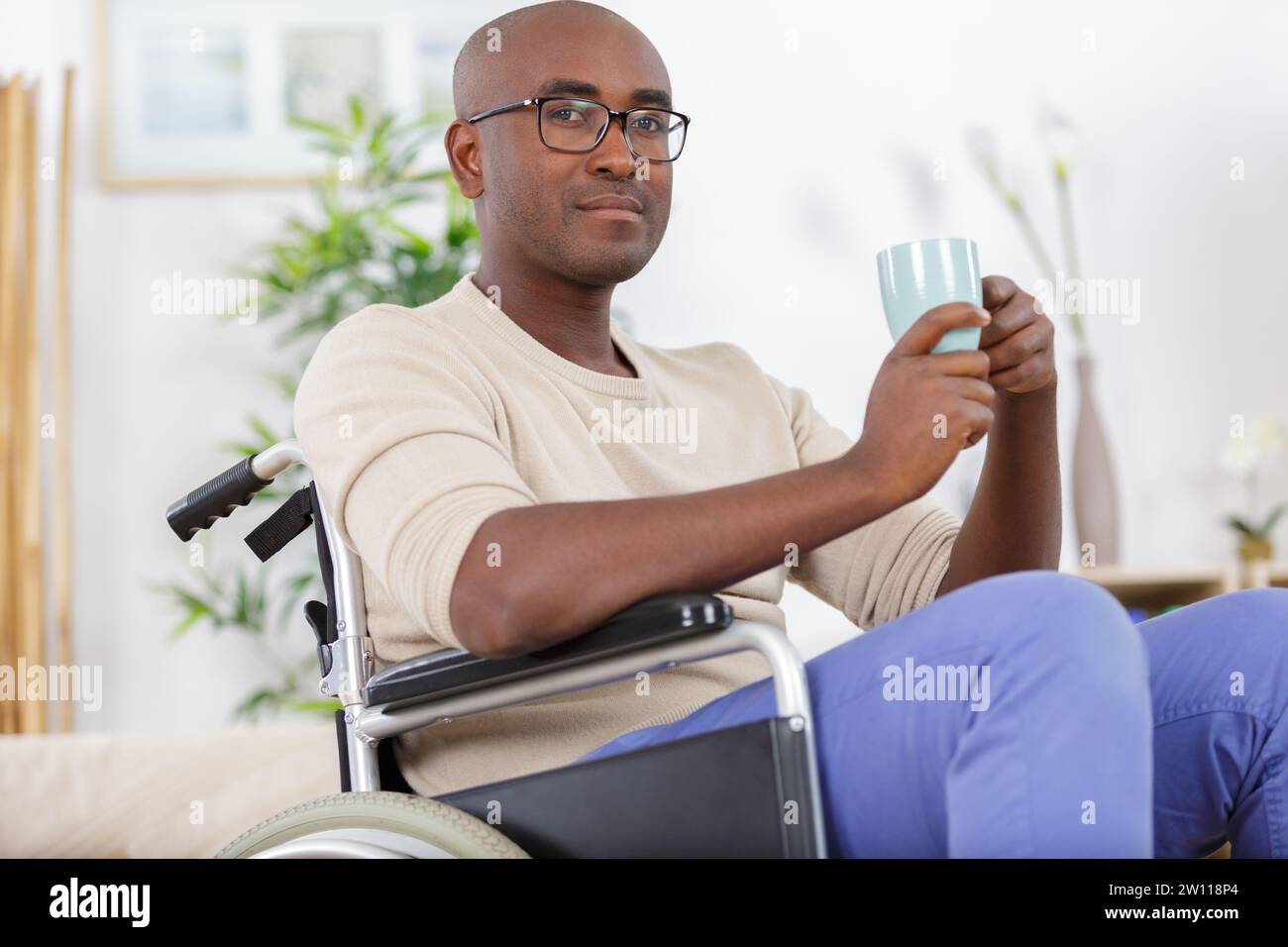 smiling disabled guy during breakfast Stock Photo - Alamy