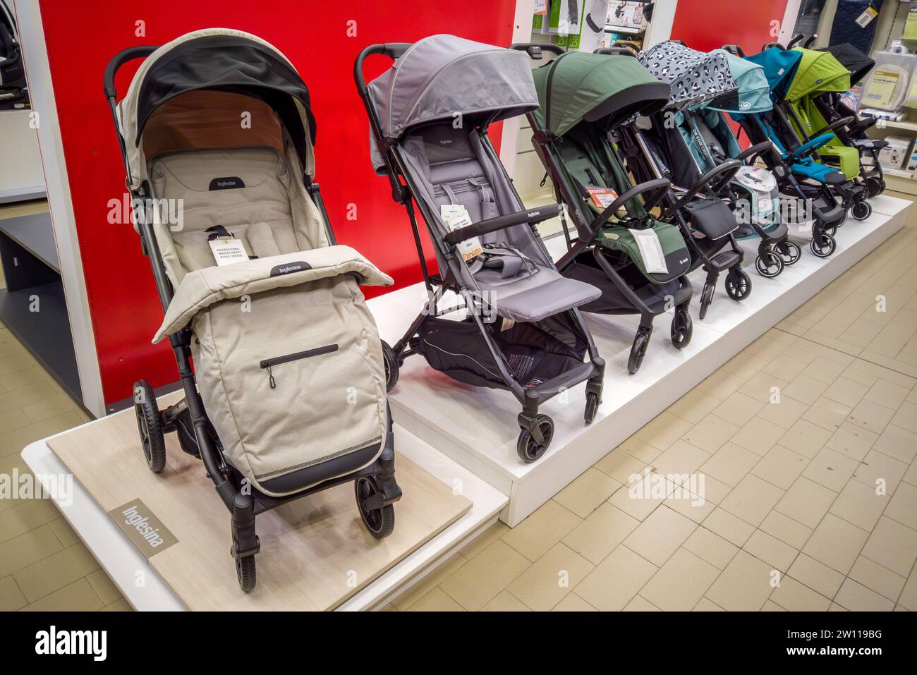 Italy - December 19, 2023: Row of baby strollers of various types ...