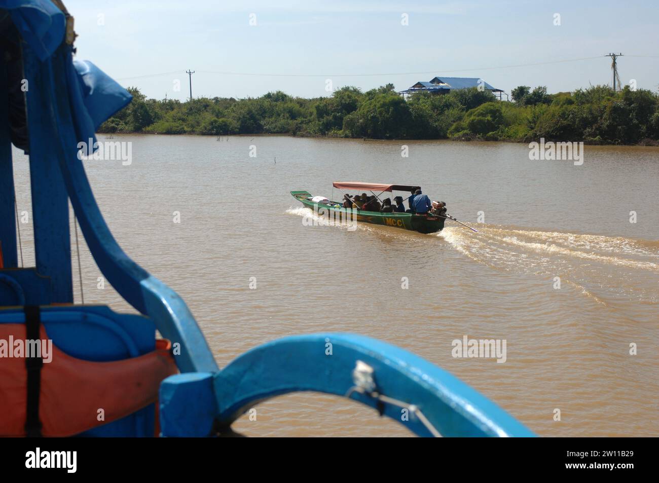 Boats moving along the waterways, Floating village Kampong Phluk in ...