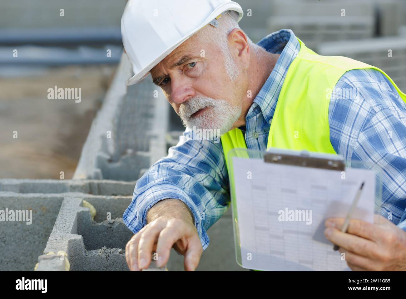 architect site manager in front of construction site Stock Photo - Alamy