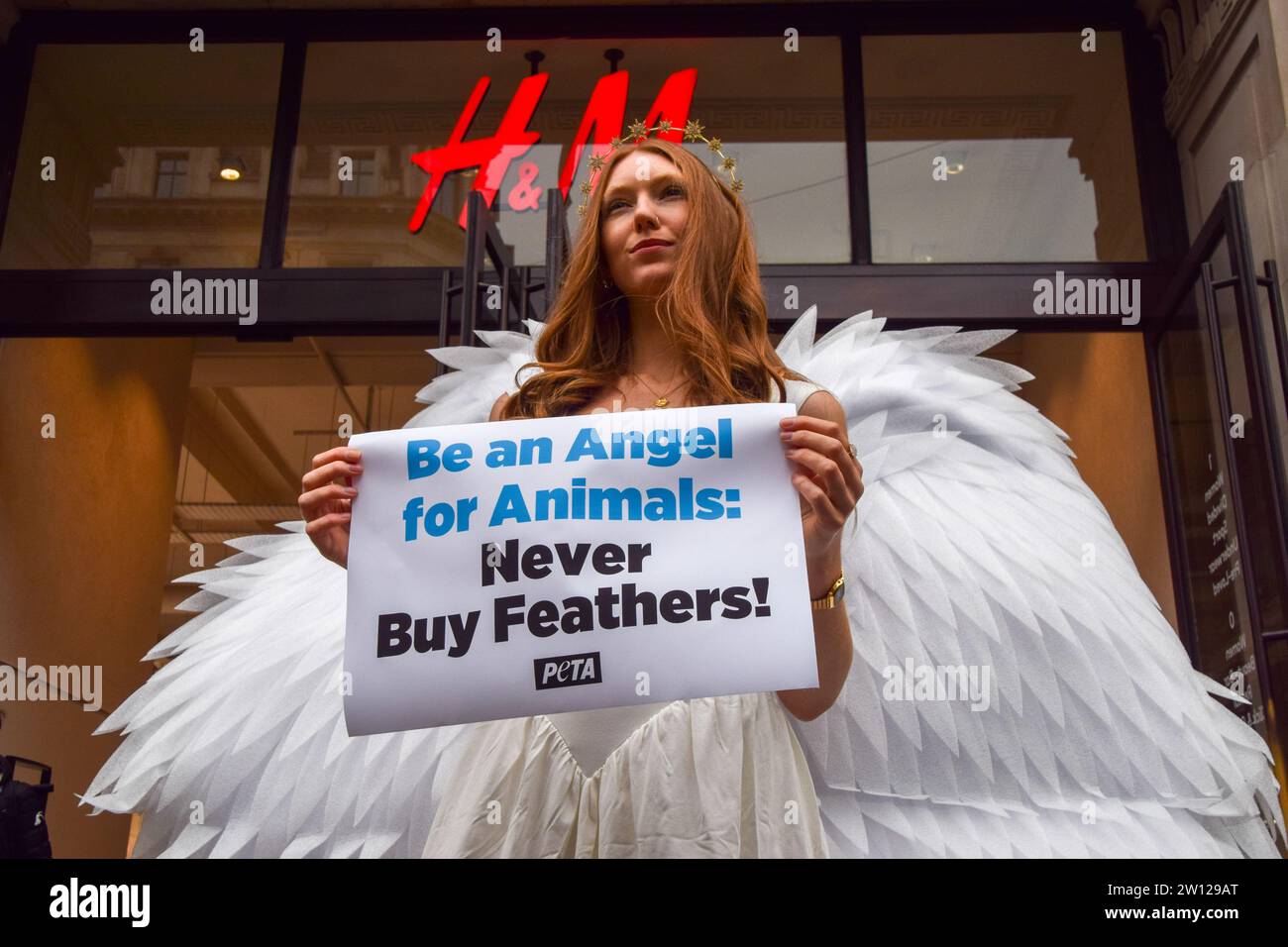 London, UK. 20th December 2023. A PETA activist dressed as an angel ...