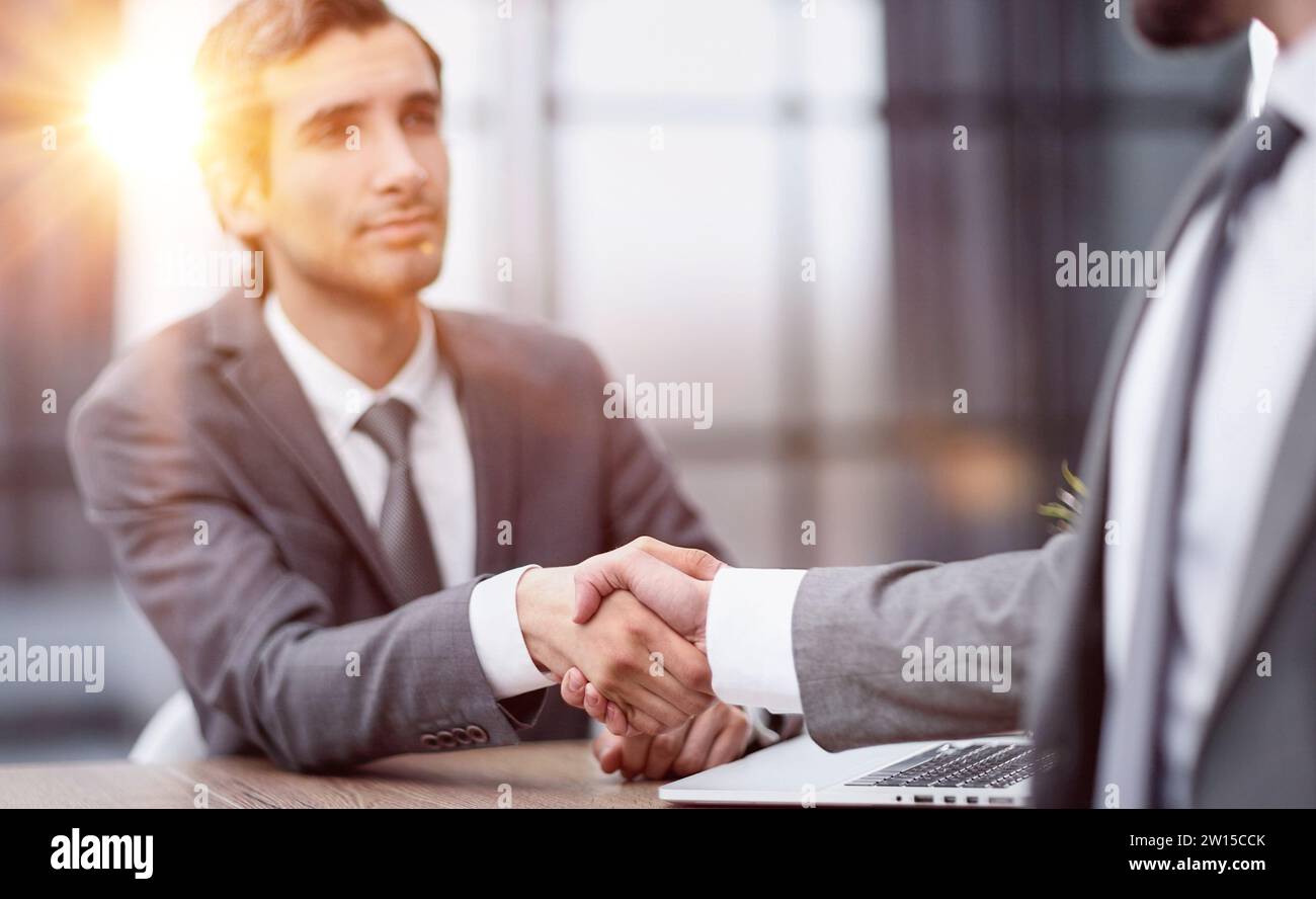 Portrait of cheerful young manager handshake with new employee Stock ...
