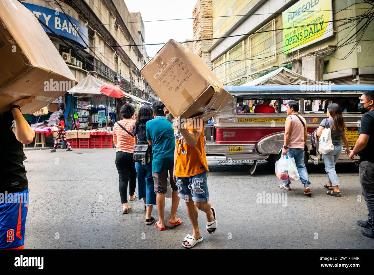 Classic jeepneys make their way through the congested market in the ...