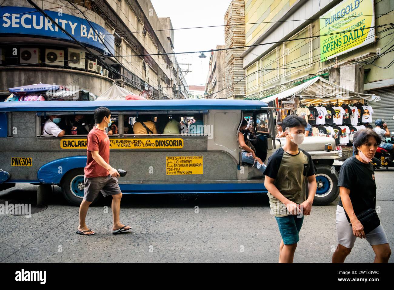 Classic jeepneys make their way through the congested market in the ...