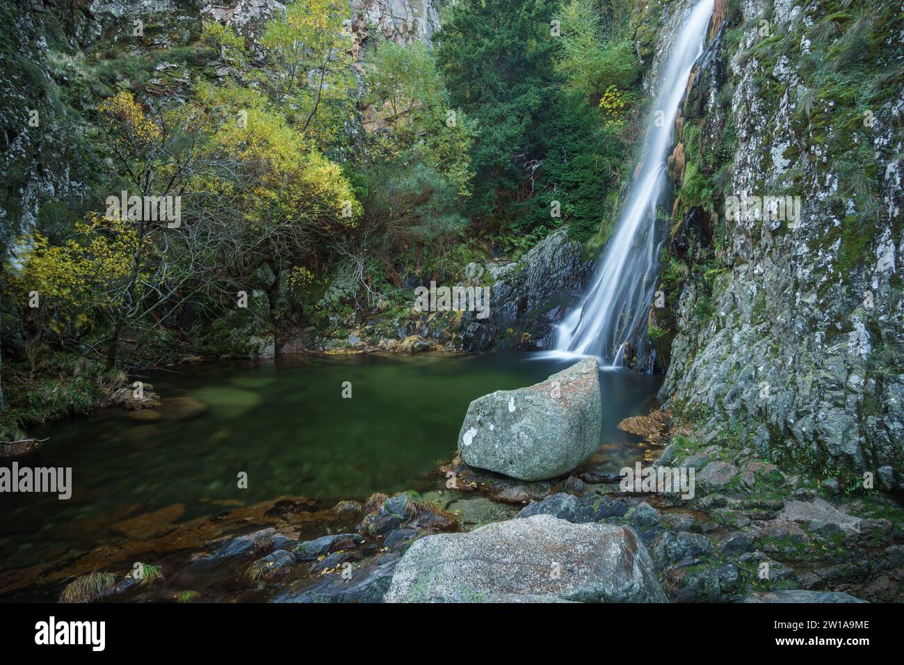 Waterfall called Poco do Inferno with water pool during autumn time ...