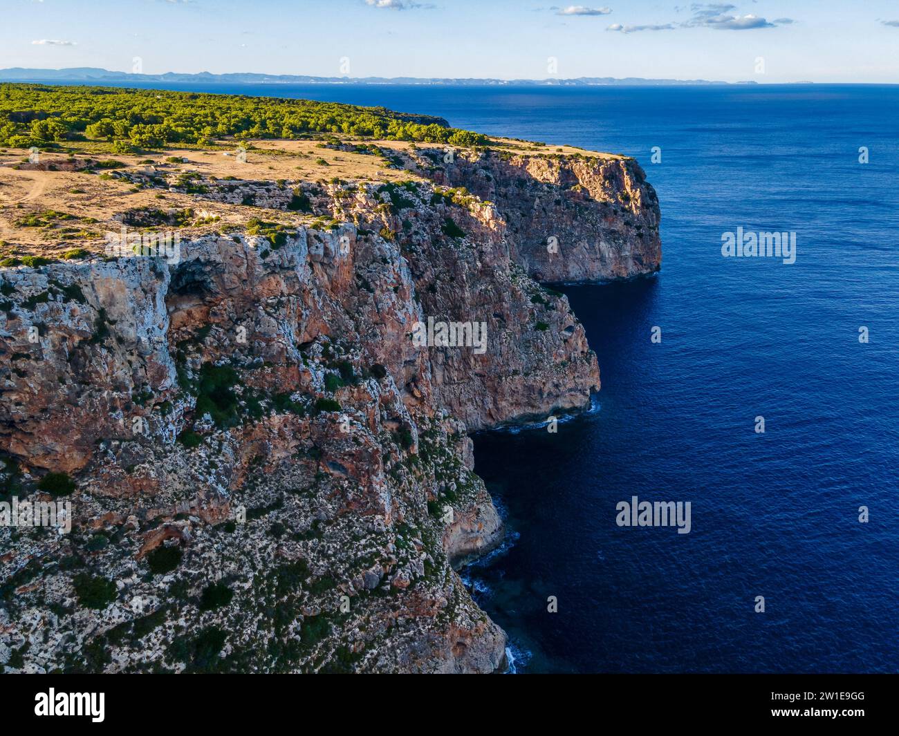 Majestic Vertical Sea Cliffs Towering Over Azure Waters Stock Photo - Alamy