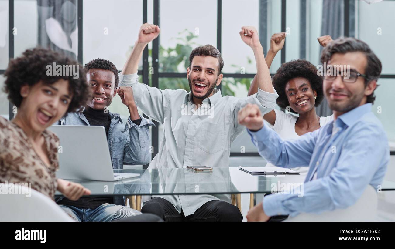 Best team ever. Portrait of extremely happy multinational coworkers are ...