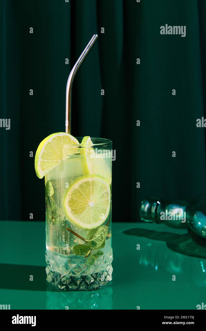 Close up photo of refreshing cold, alcohol mojito with slice of limes ...