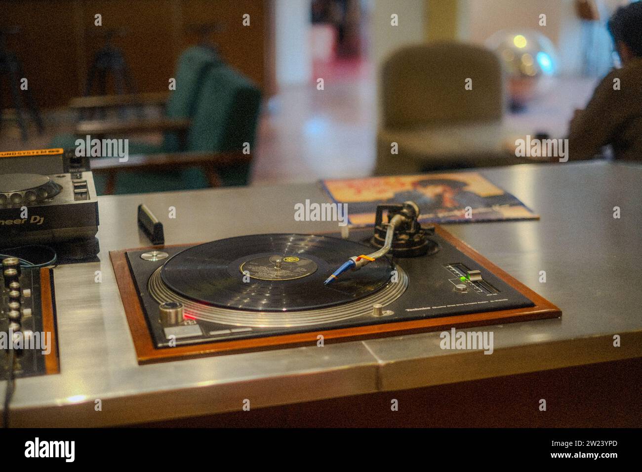 Dive into the intimate world of vintage vinyl with a grainy close-up of ...