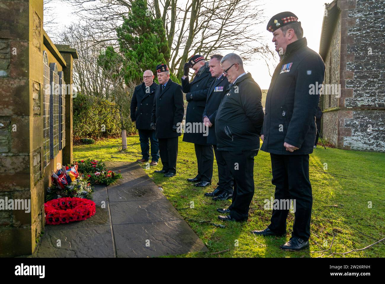People lay wreaths before a remembrance service at Tundergarth Church ...