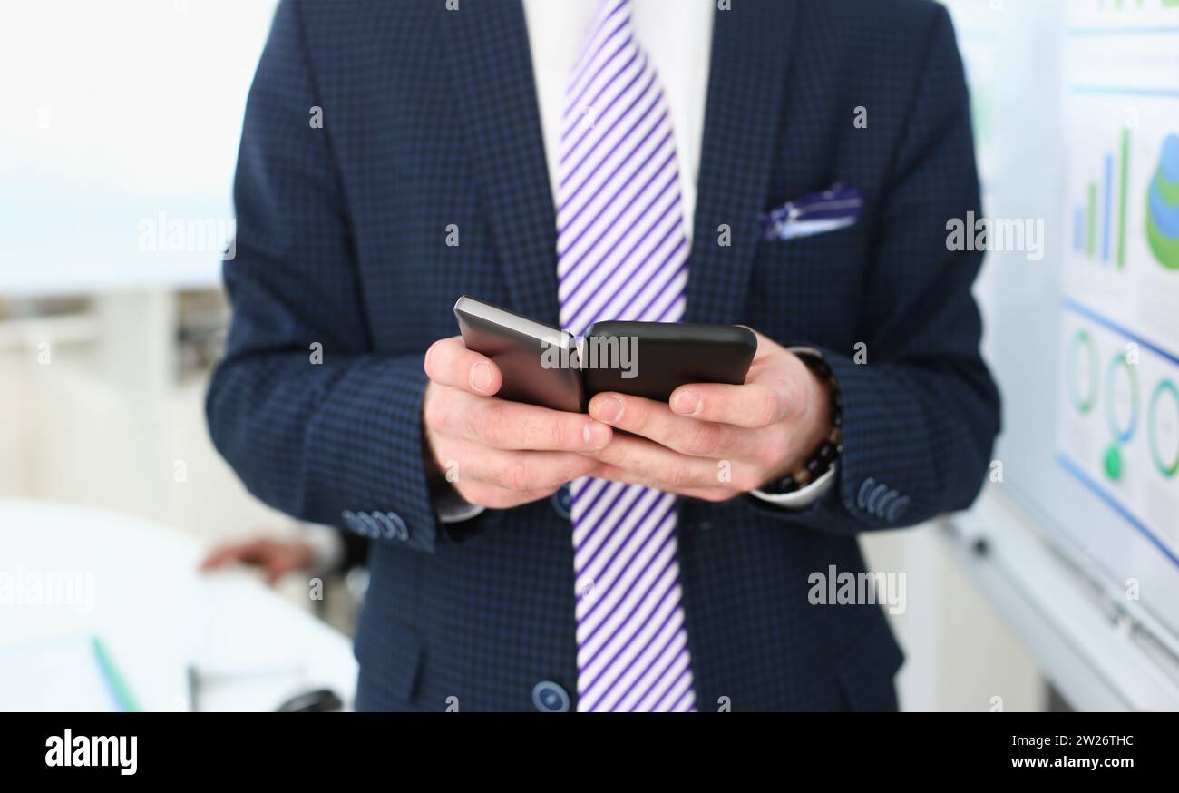 Smart man with cellphones Stock Photo - Alamy
