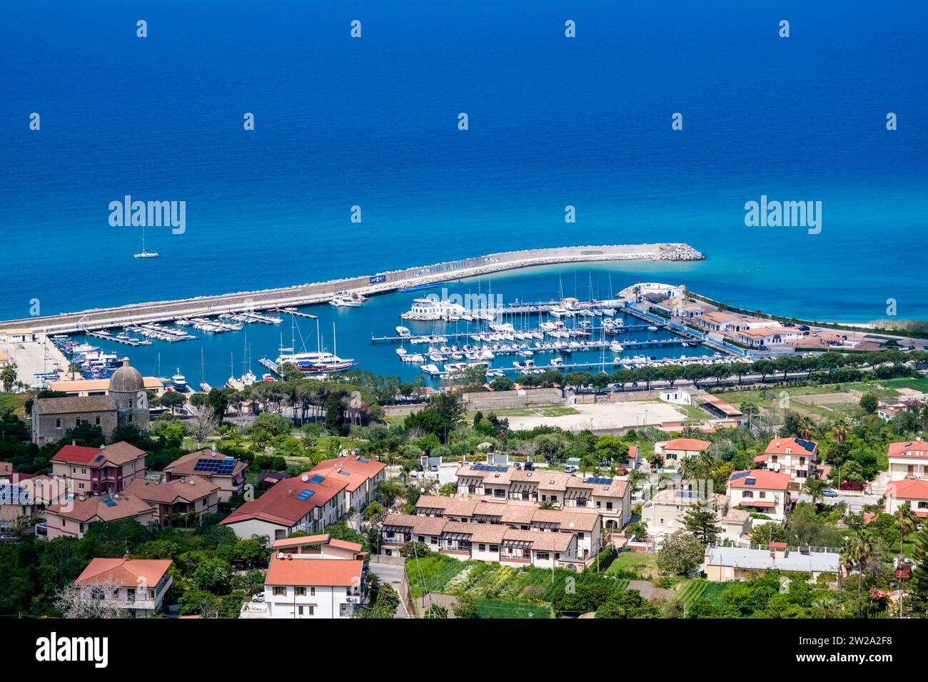 Aerial view of the harbour and marina of Tropea, with many boats at ...