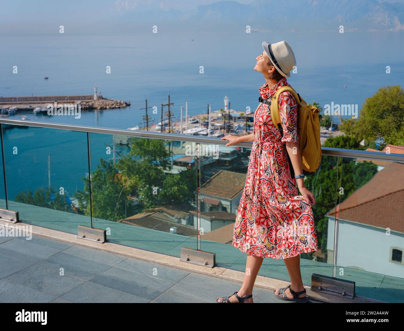 female summer travel to Antalya, Turkey. young asian woman in red dress ...