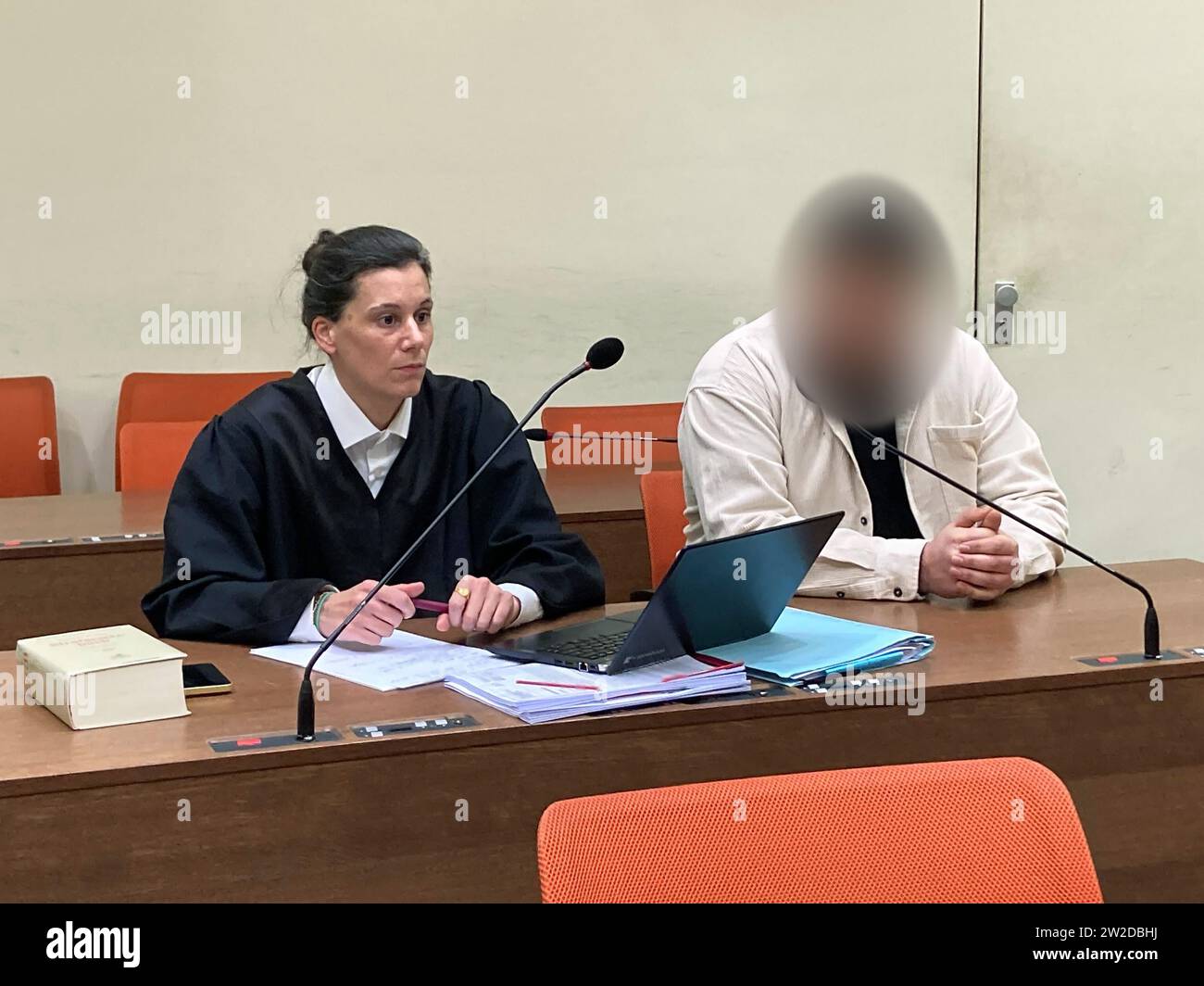 Munich, Germany. 21st Dec, 2023. A 22-year-old man and his lawyer ...