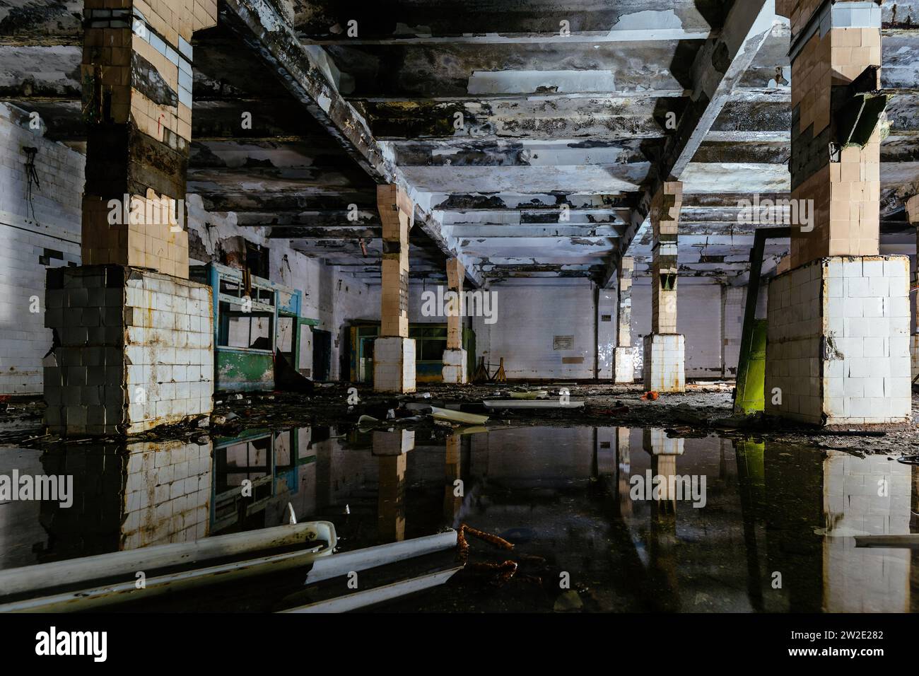 Dark flooded rotten abandoned industrial building Stock Photo - Alamy