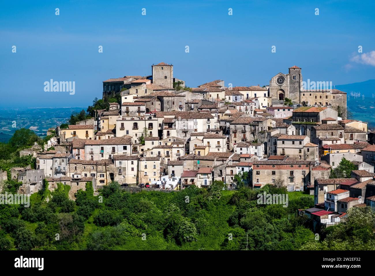 The small hilltop town of Altomonte with the massive walls of the ...