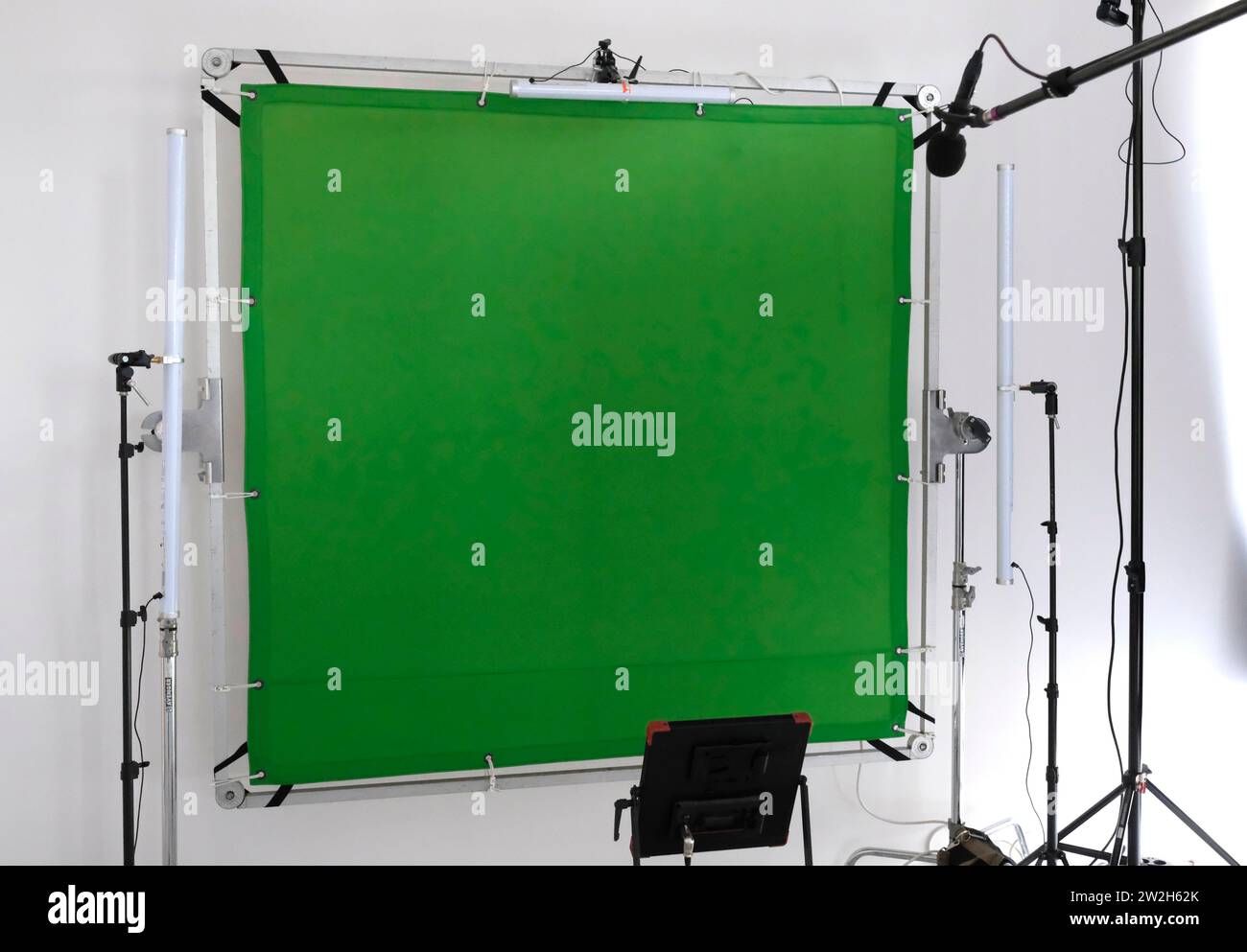 Setup in a TV studio with green screen, lights, and camera Stock Photo ...