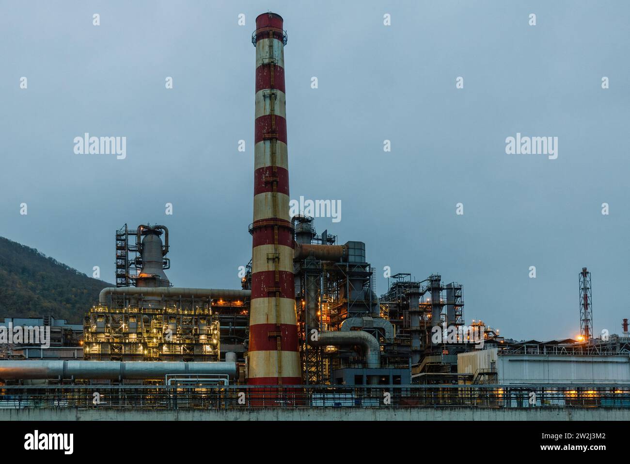 Chemical factory at night. Rectification towers Stock Photo - Alamy