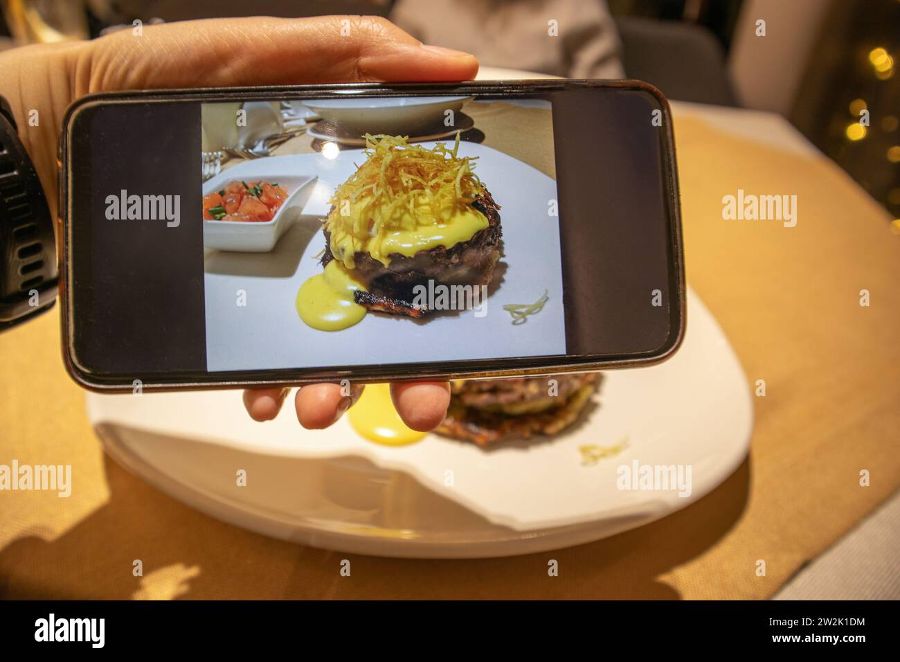photo of a smartphone screen with food served in a restaurant. food ...