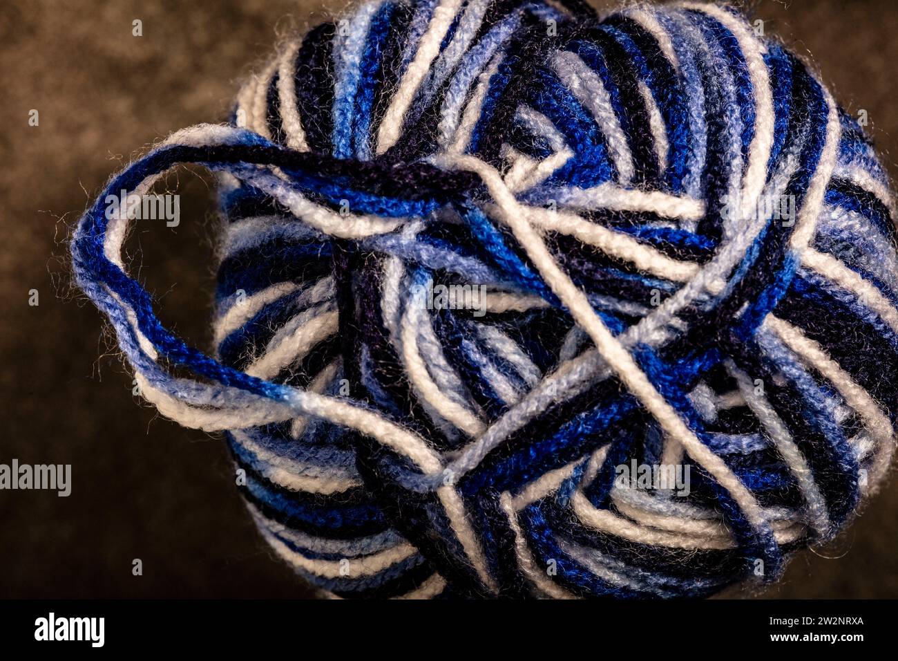 Close up semi abstract still life of blue and white wool showing ...