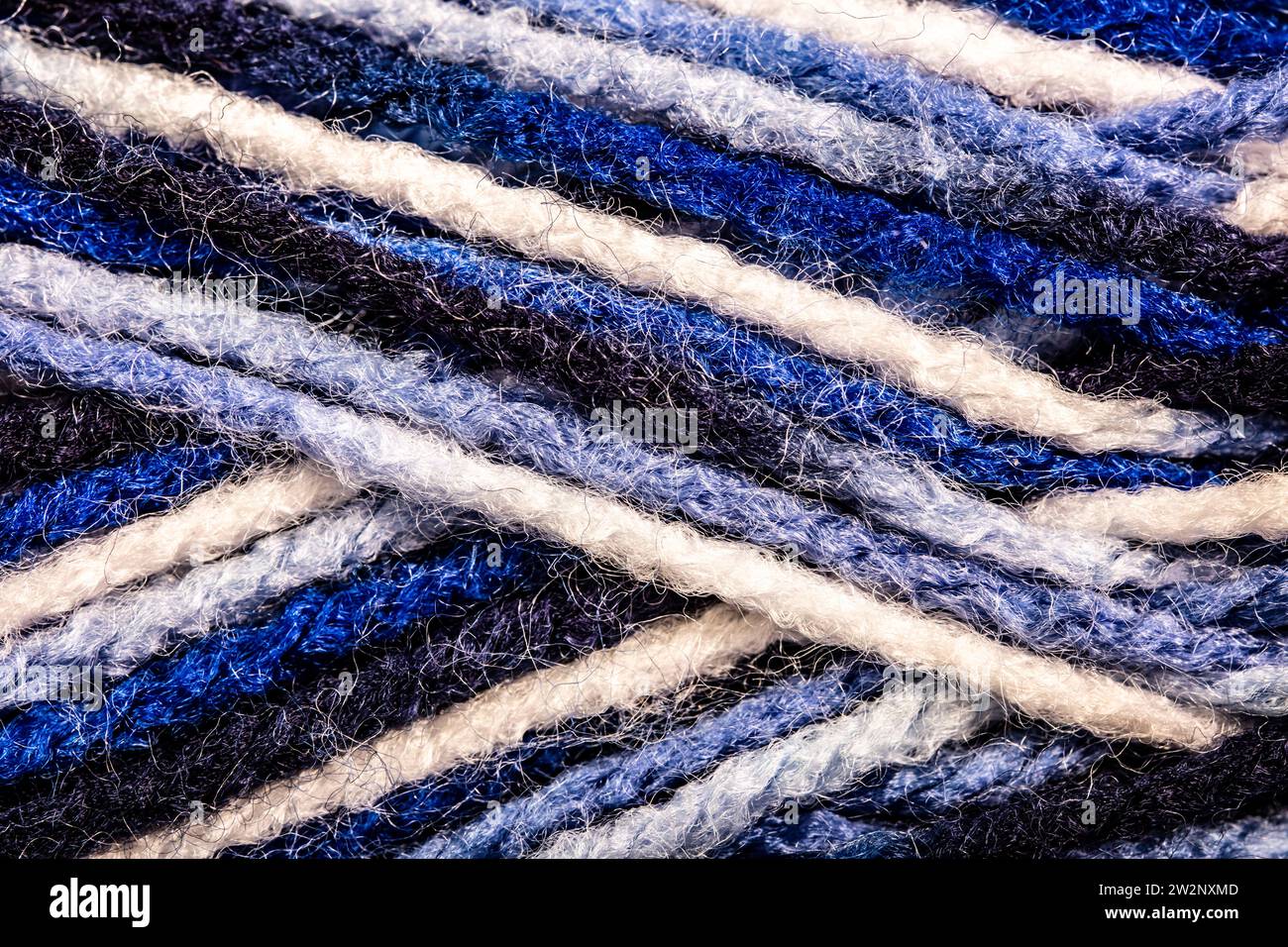 Close up semi abstract still life of blue and white wool showing ...