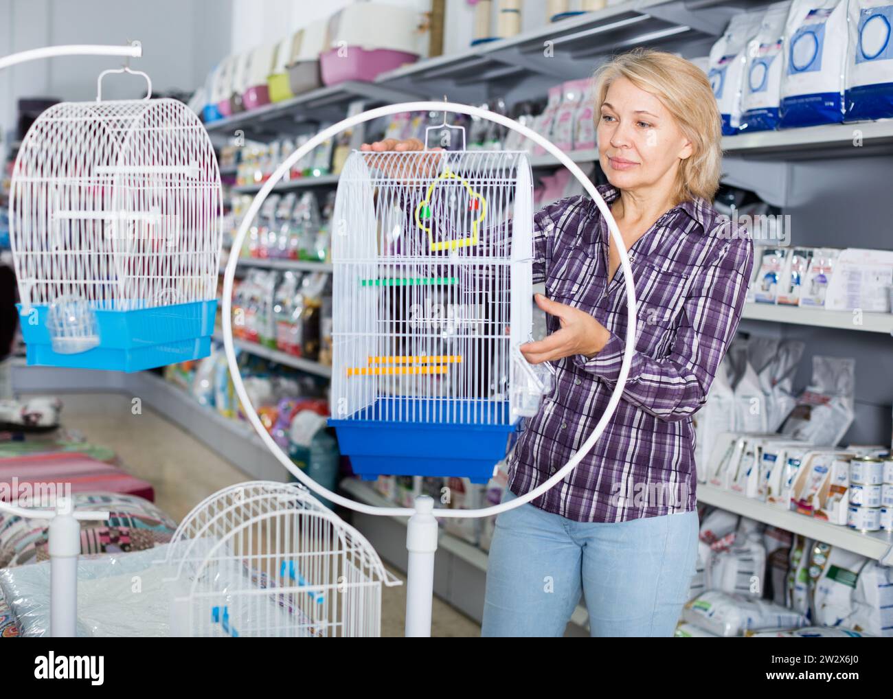Woman alone bird feeder hi-res stock photography and images - Alamy