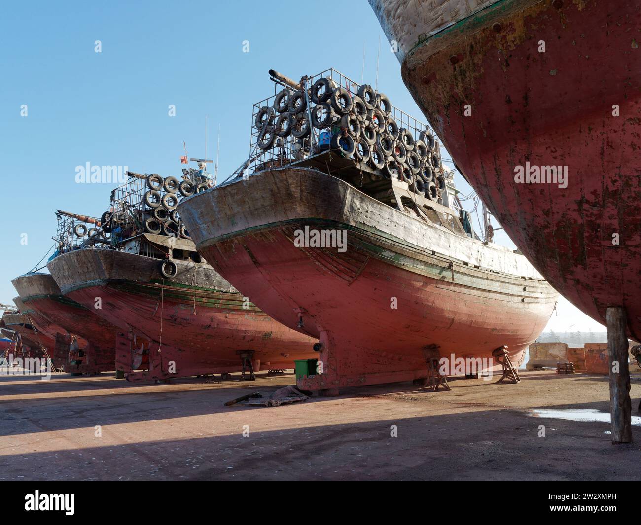 Large vessels with tires at a dry dock probably for maintenance in ...