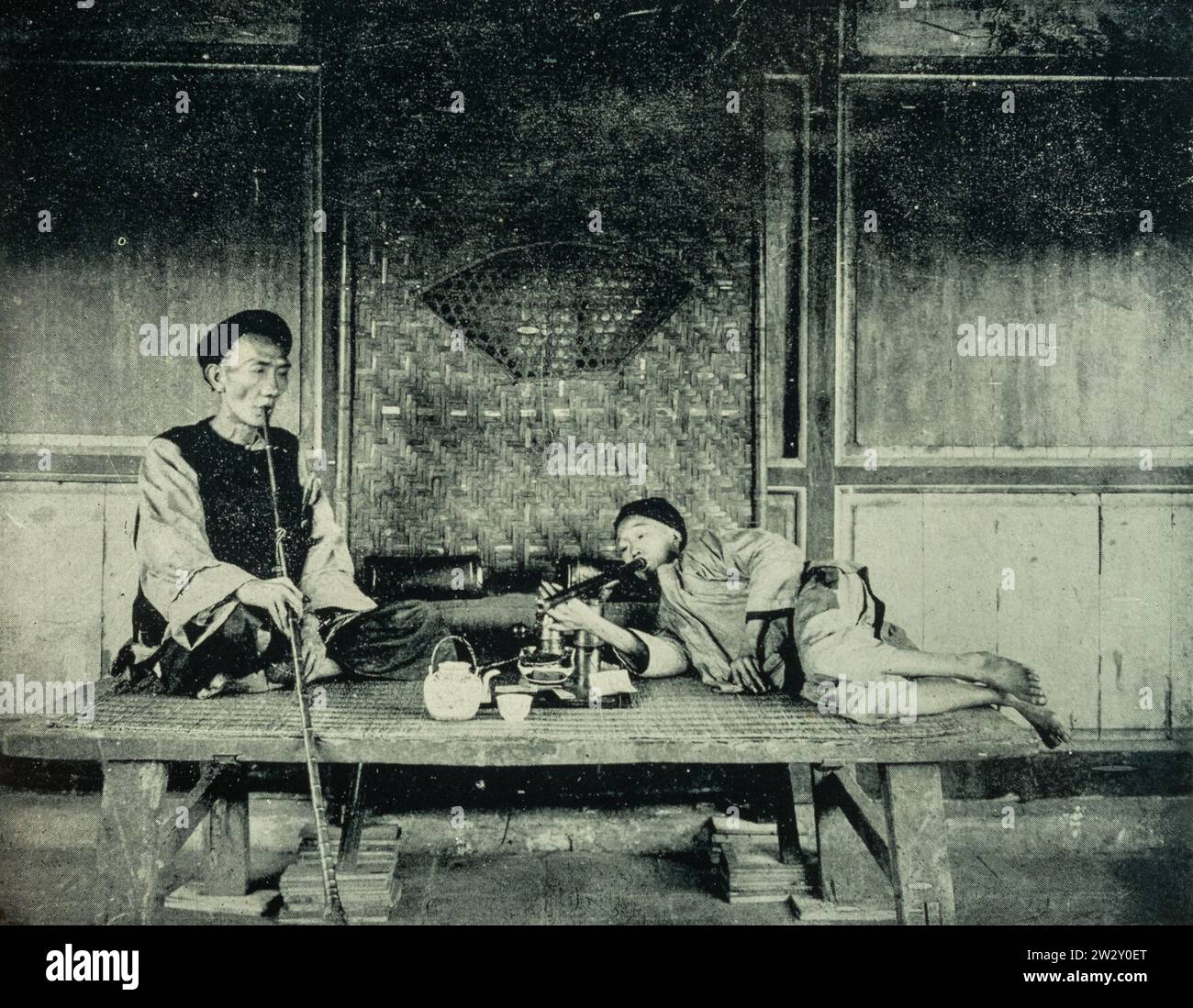 Opium smoking in Taiwan. Historical picture taken in late Qing Dynasty ...