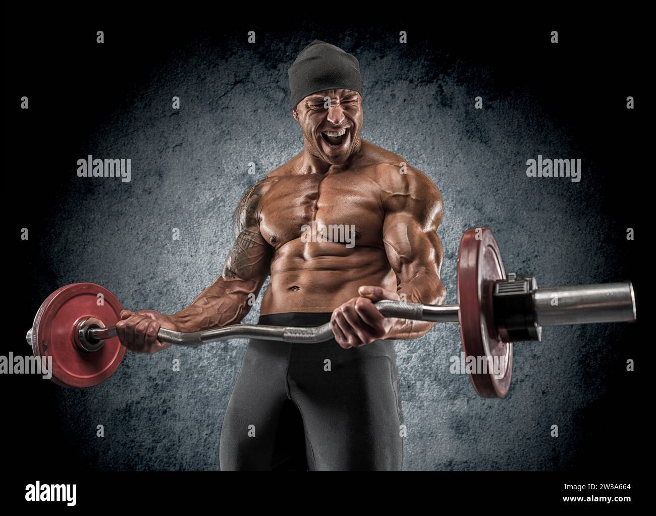 Handsome power athletic man bodybuilder doing exercises with barbell ...