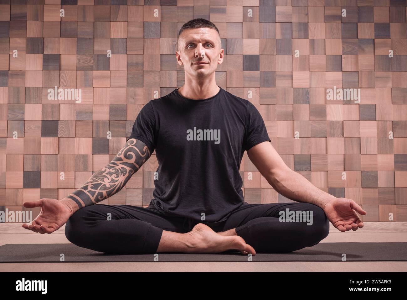 Adult man performs asana exercises. Yoga concept. Sports and healthy ...