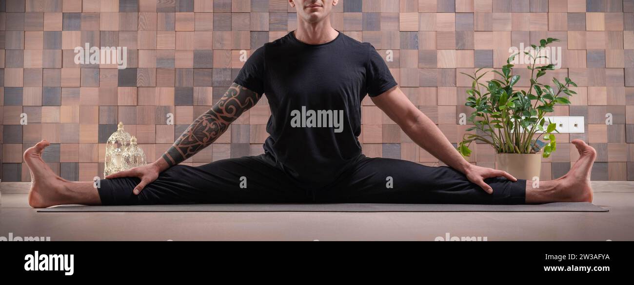 Adult man performs asana exercises. Yoga concept. Sports and healthy ...