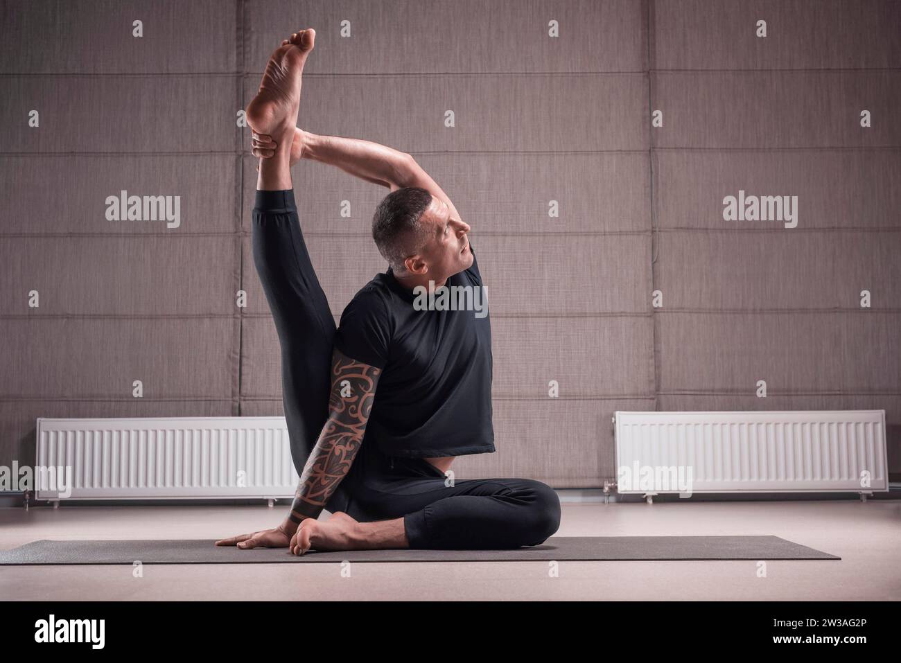 Adult man performs asana exercises. Yoga concept. Sports and healthy ...
